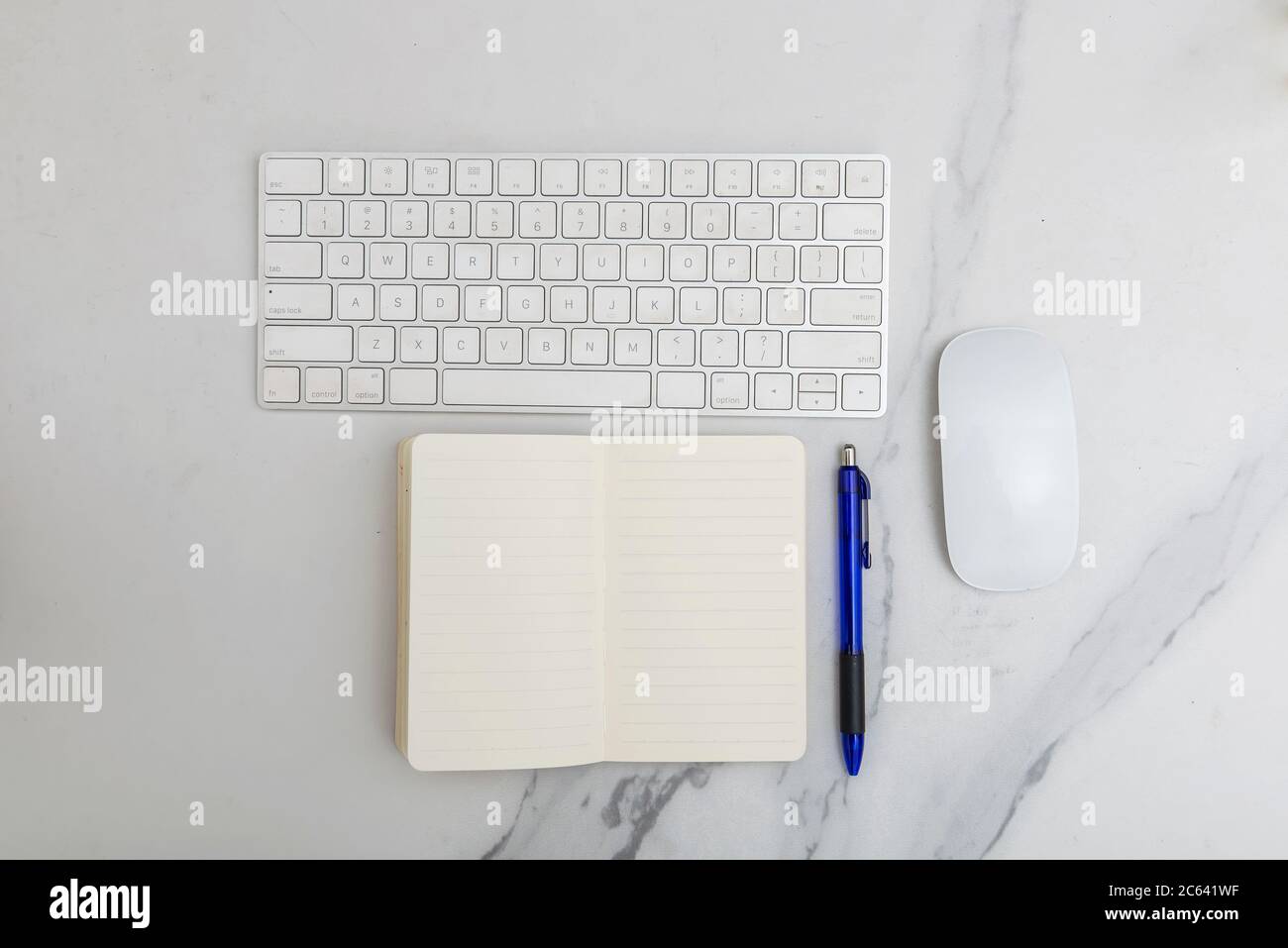 Keyboard with mouse and notebook with pen on the work desk Stock Photo ...