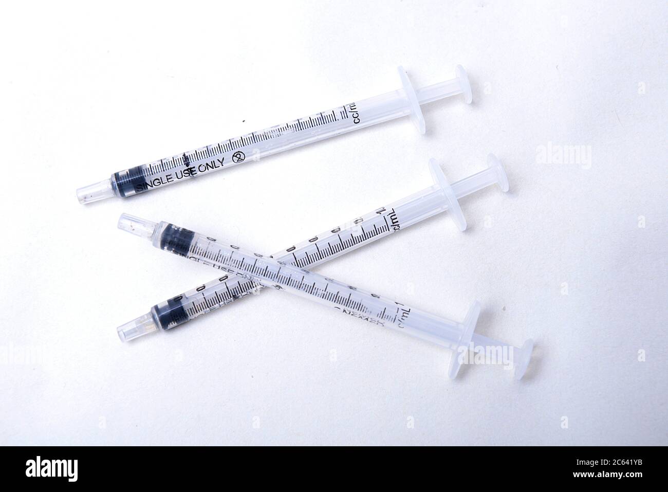 Syringe pump isolated over white background Stock Photo - Alamy
