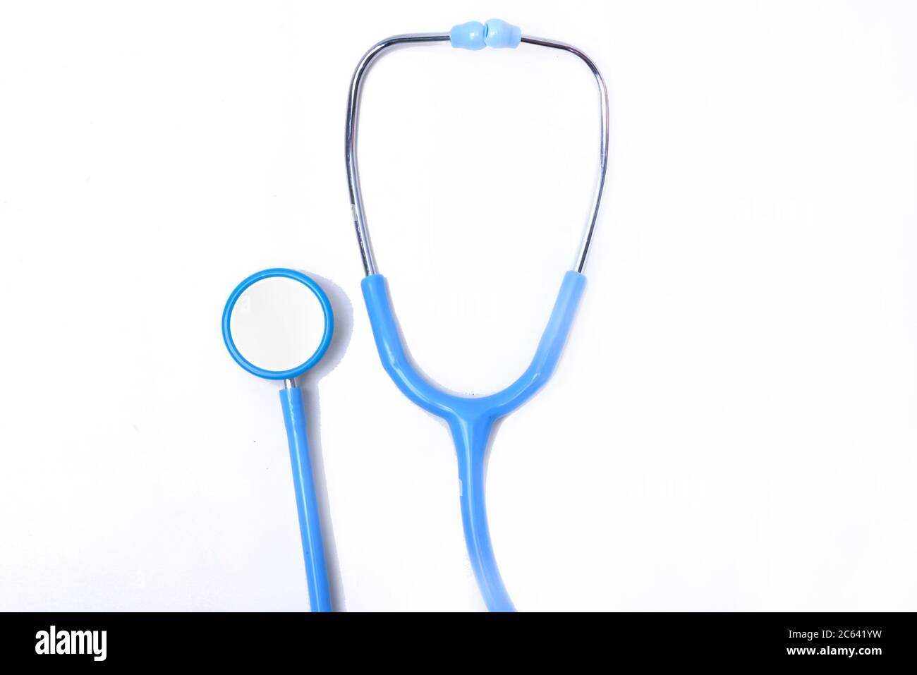 Blue stethoscope isolated over white background Stock Photo - Alamy