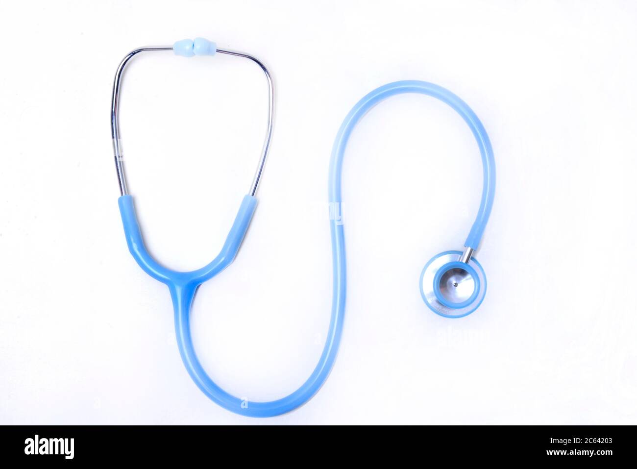 Blue stethoscope isolated over white background Stock Photo - Alamy
