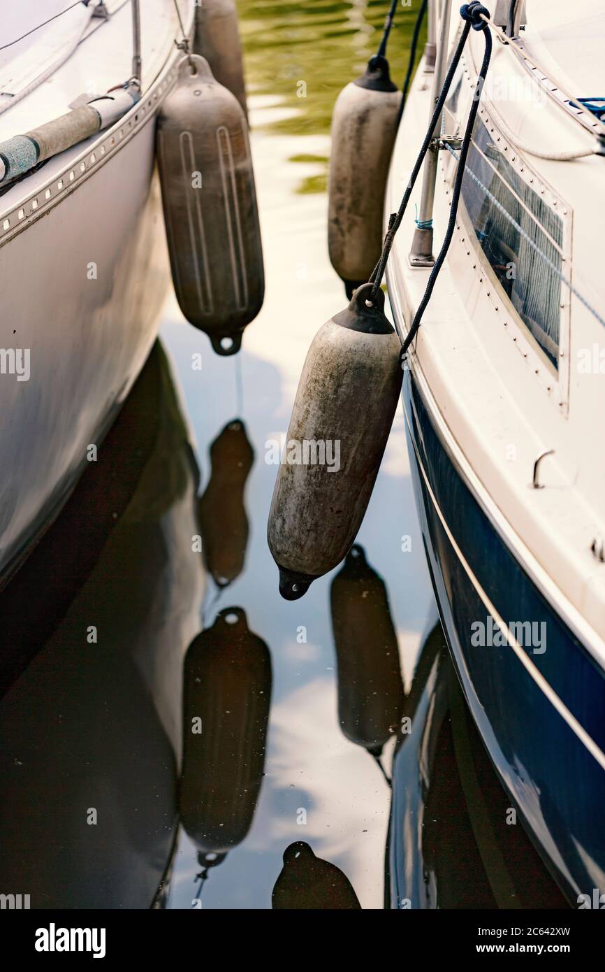 Yacht fenders attached to board Stock Photo - Alamy