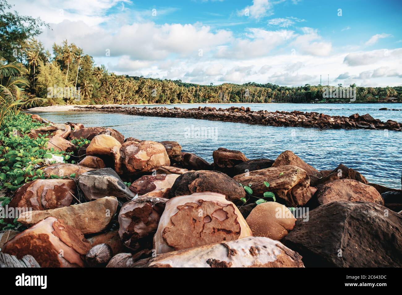 Stone on beach at sea with the sky Stock Photo - Alamy