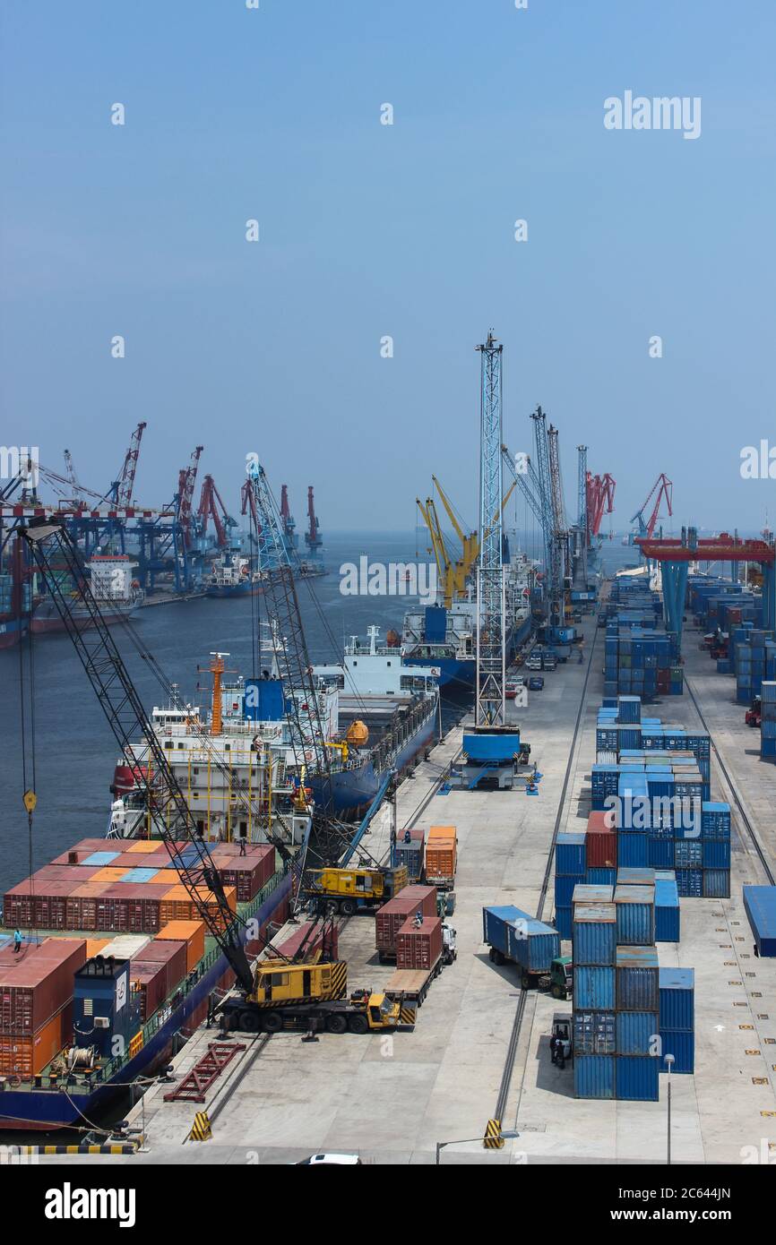 Loading unloading shipping cargo with industrial crane. Export and ...