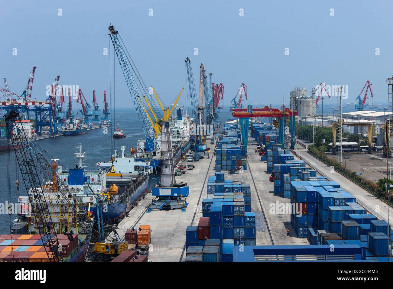 Loading unloading shipping cargo with industrial crane. Export and ...