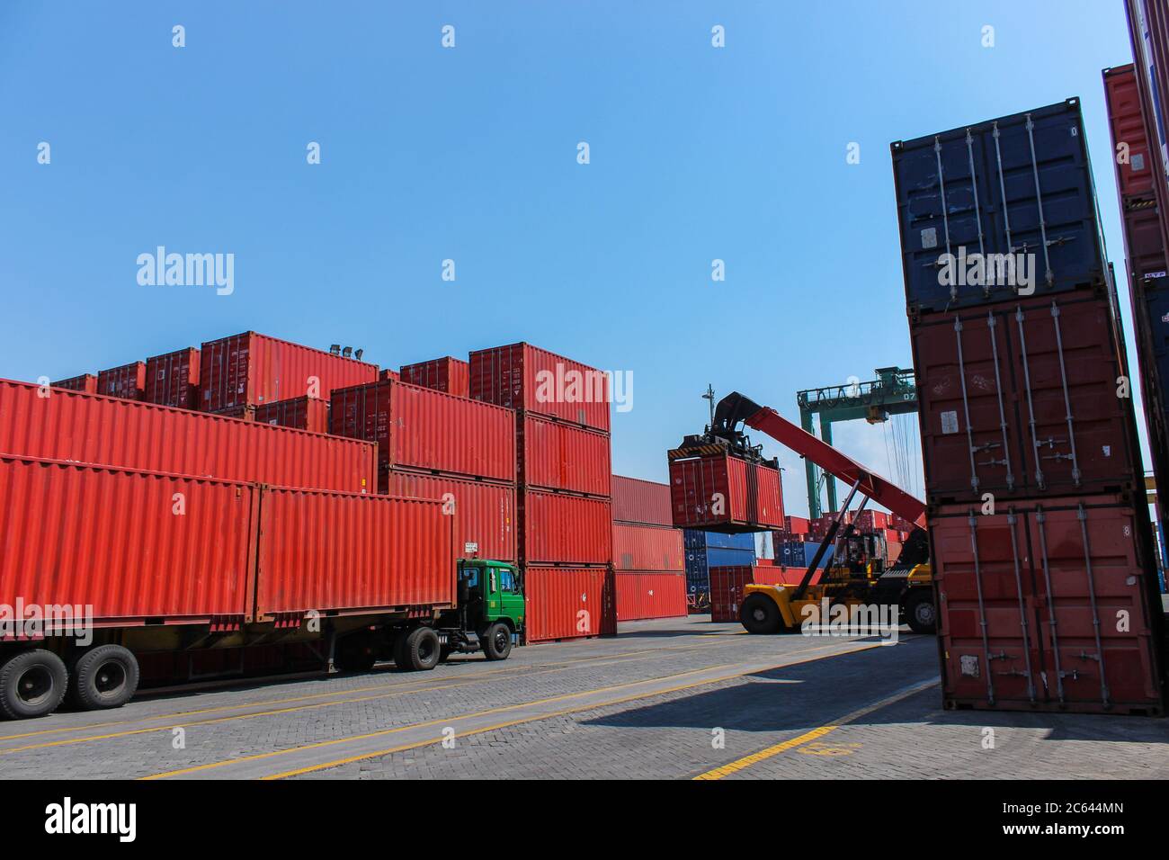 Loading unloading shipping cargo with industrial crane. Export and ...