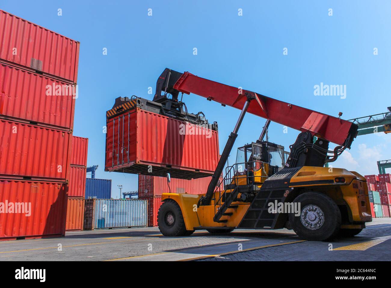 Loading unloading shipping cargo with industrial crane. Export and ...