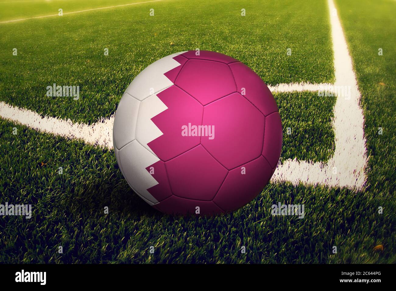 Qatar flag on ball at corner kick position, soccer field background ...