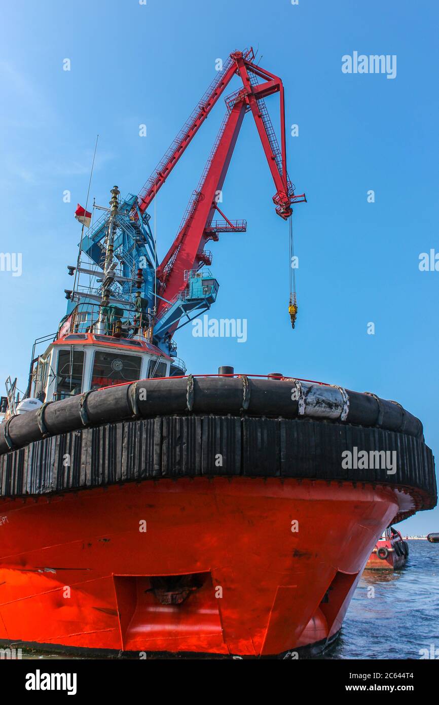 Crane ship to move goods and shipping containers in export and import ...
