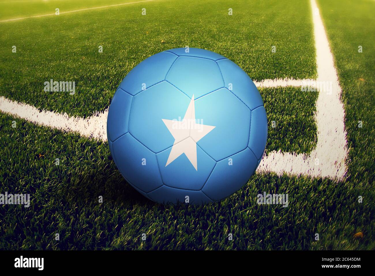 Somalia flag on ball at corner kick position, soccer field background ...