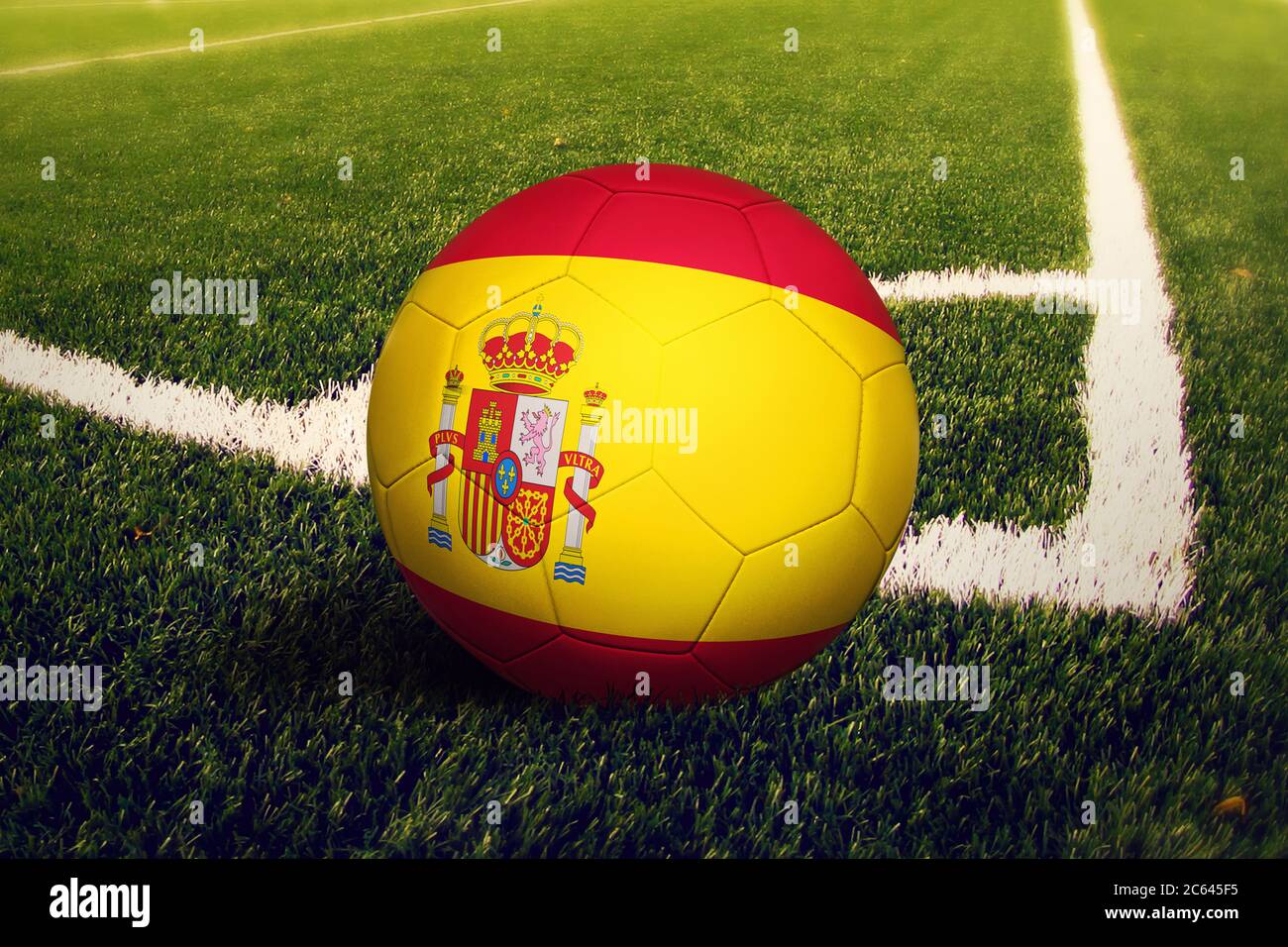 Spain flag on ball at corner kick position, soccer field background ...