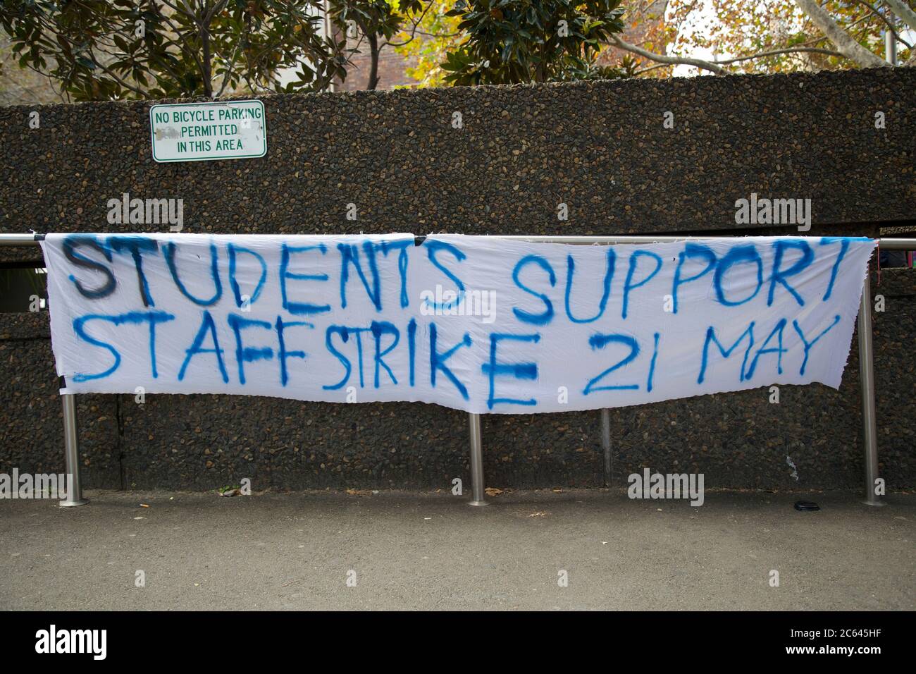 A banner saying, ‘Students support staff strike 21 May’ attached to a ...