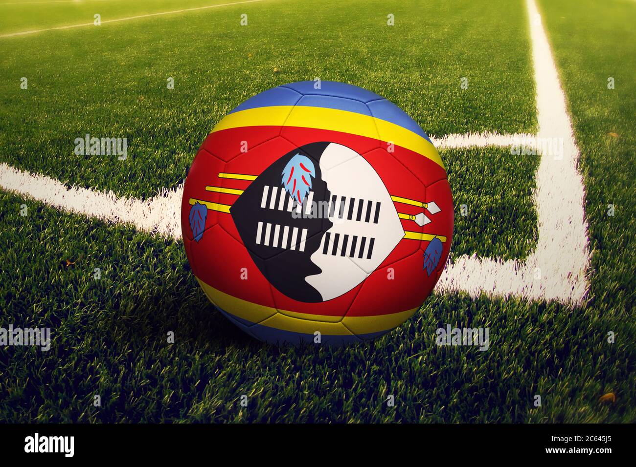 Swaziland flag on ball at corner kick position, soccer field background ...