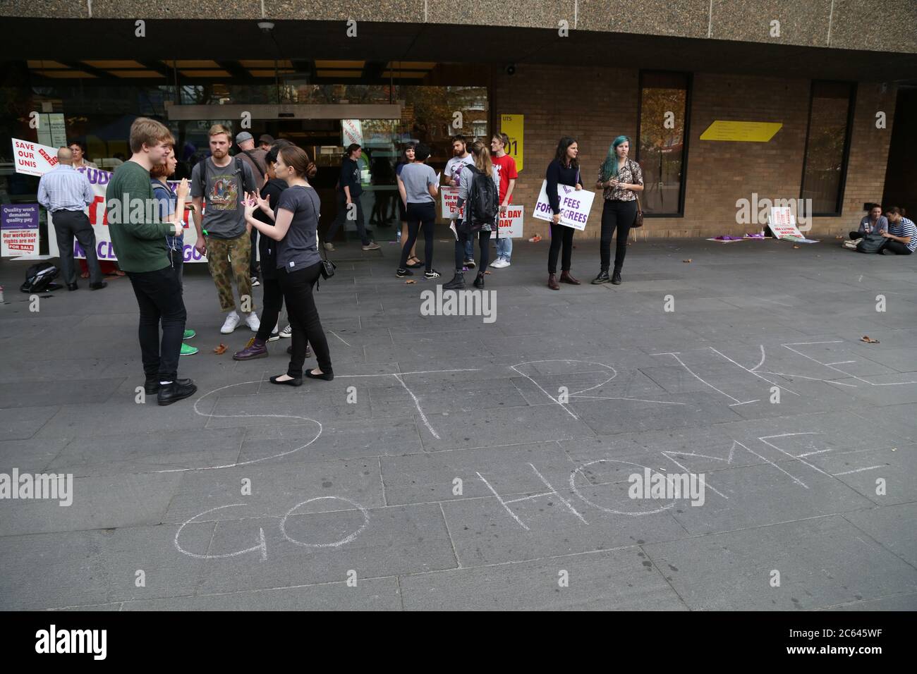 “Strike go home” is written in chalk on the ground outside the main ...