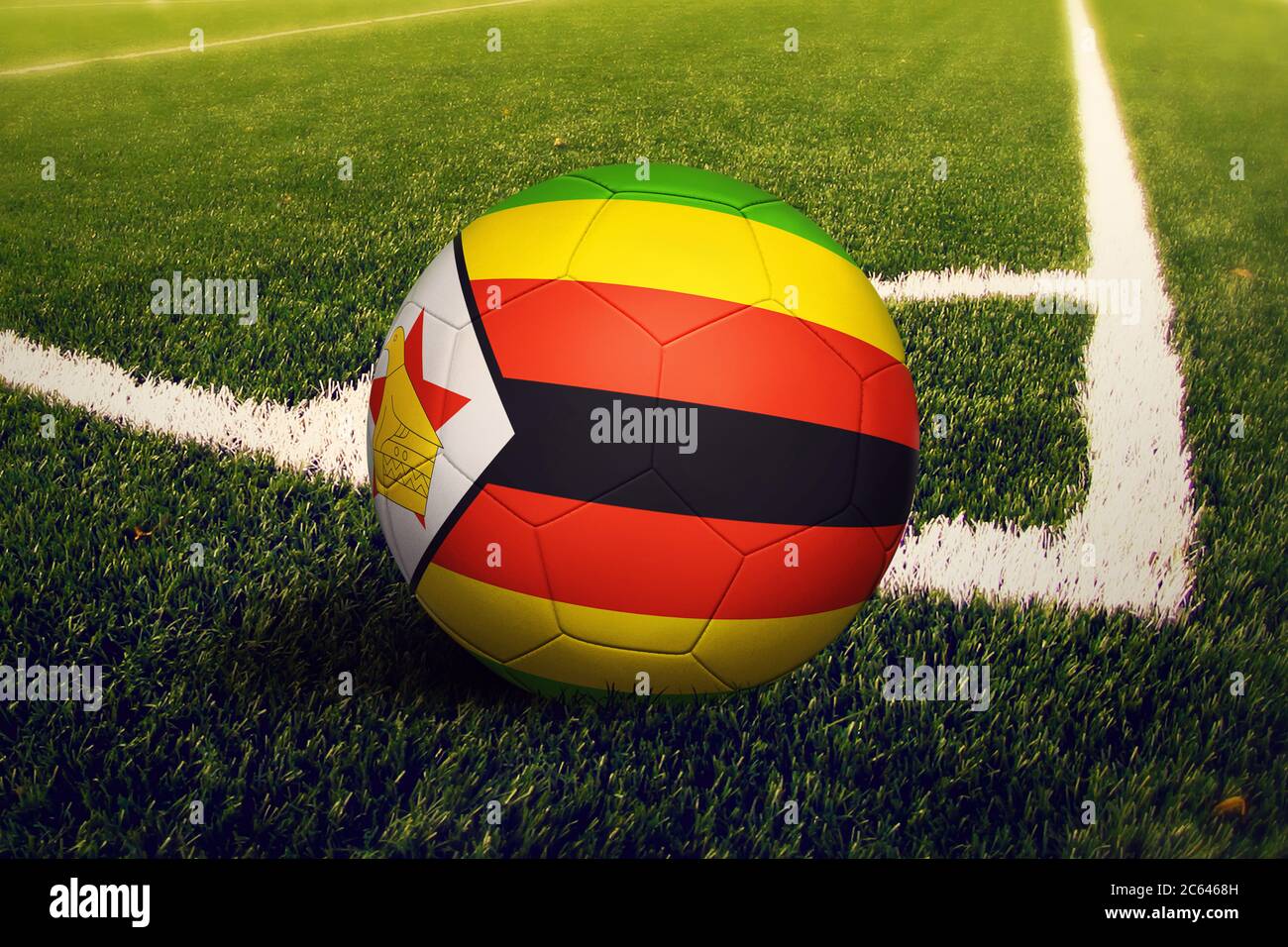 Zimbabwe flag on ball at corner kick position, soccer field background ...