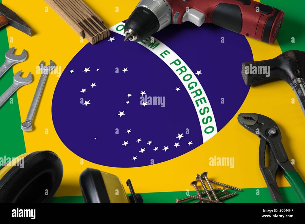 Brazil flag on repair tool concept wooden table background. Mechanical ...