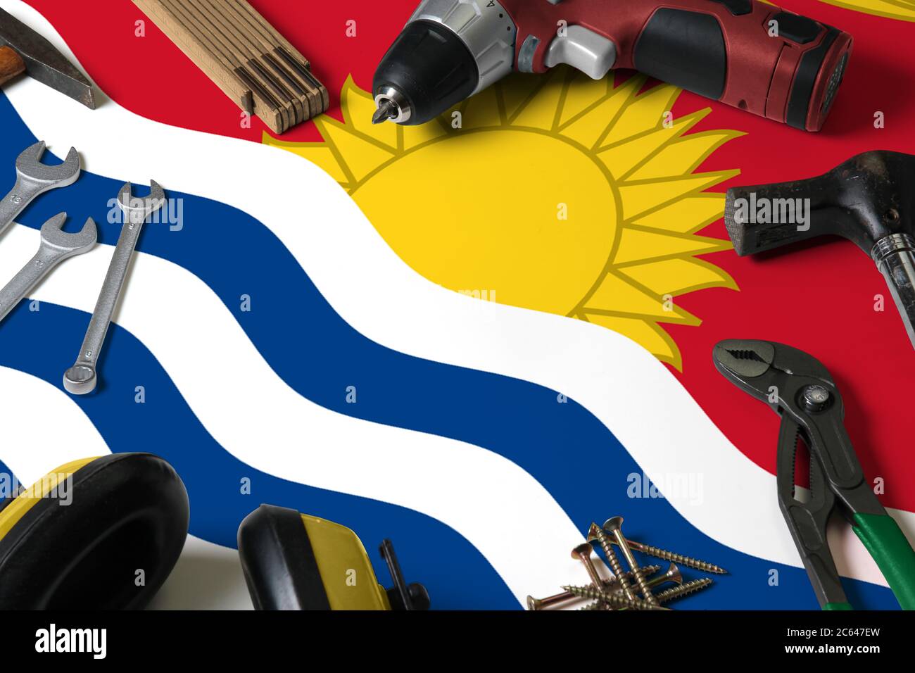 Kiribati flag on repair tool concept wooden table background ...