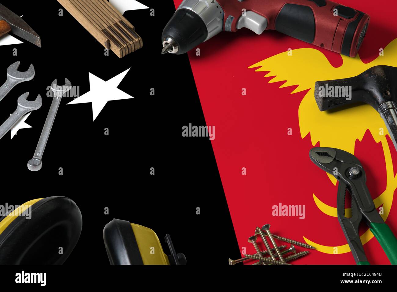 Papua New Guinea flag on repair tool concept wooden table background ...