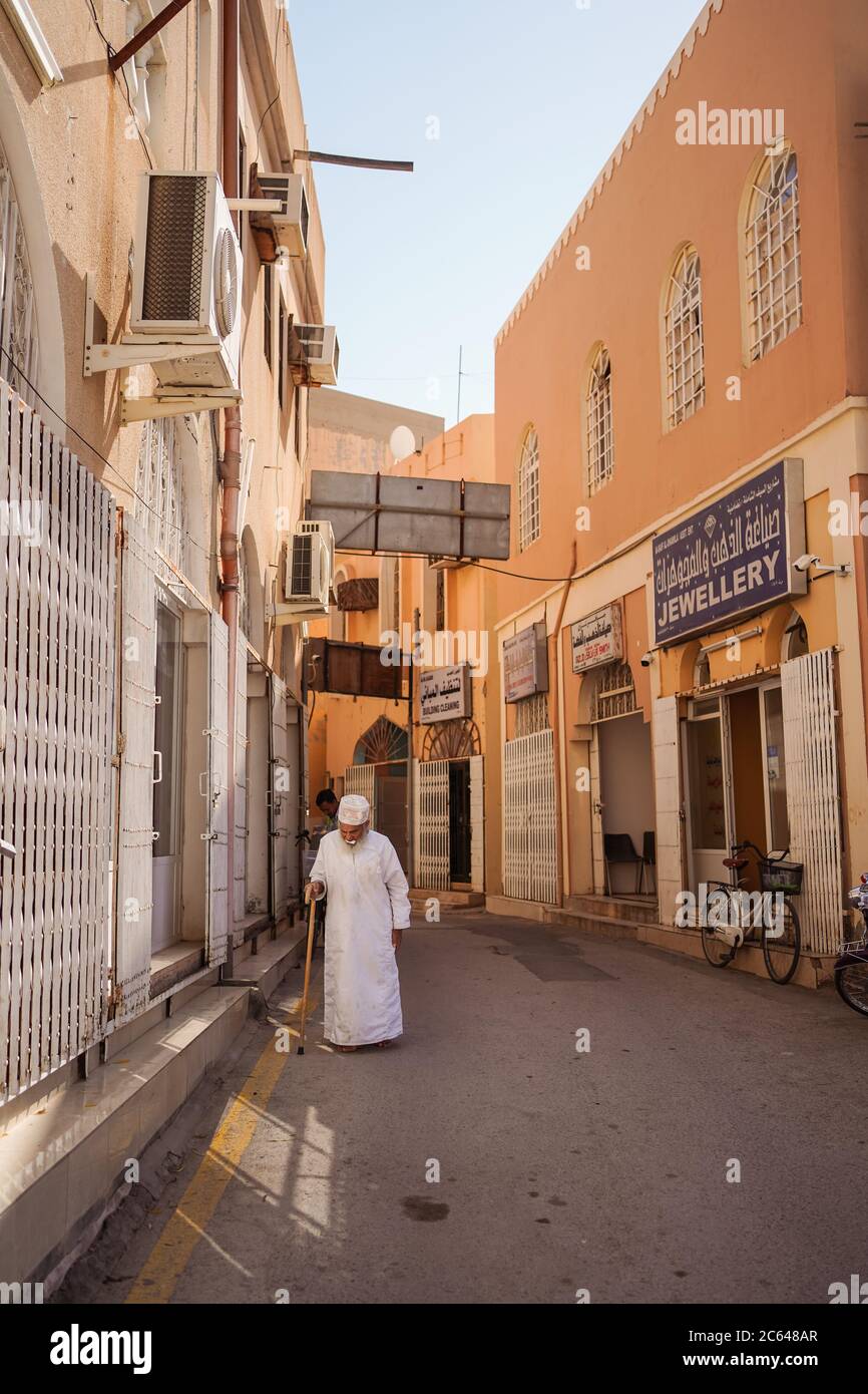 Nizwa / Oman - February 15, 2020: old Omani Muslim man walking in the ...