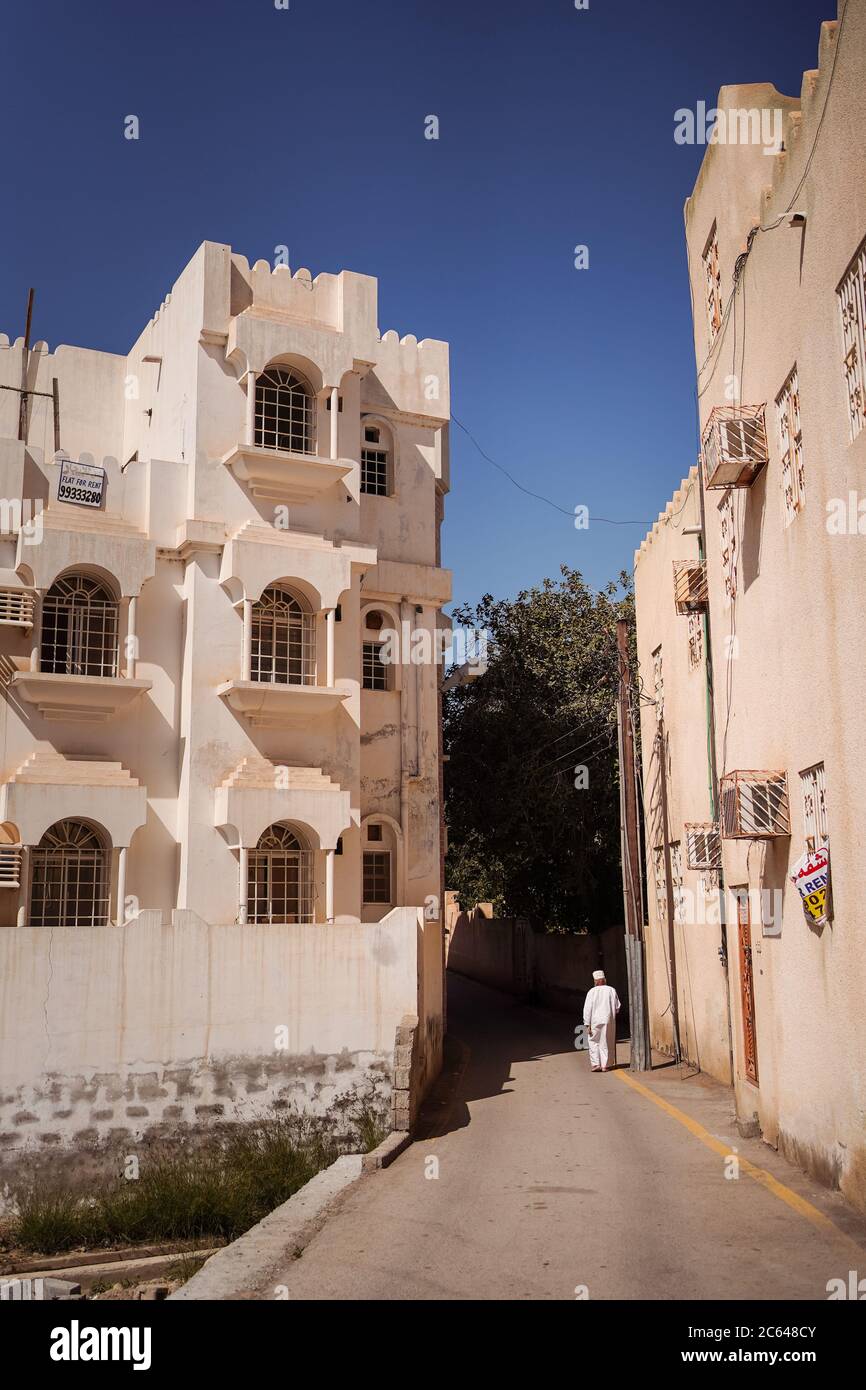 Nizwa / Oman - February 15, 2020: old Omani Muslim man walking in the ...