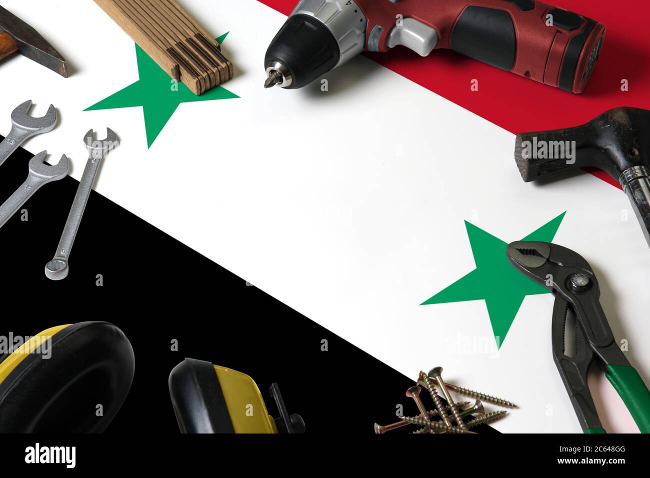 Syria flag on repair tool concept wooden table background. Mechanical ...