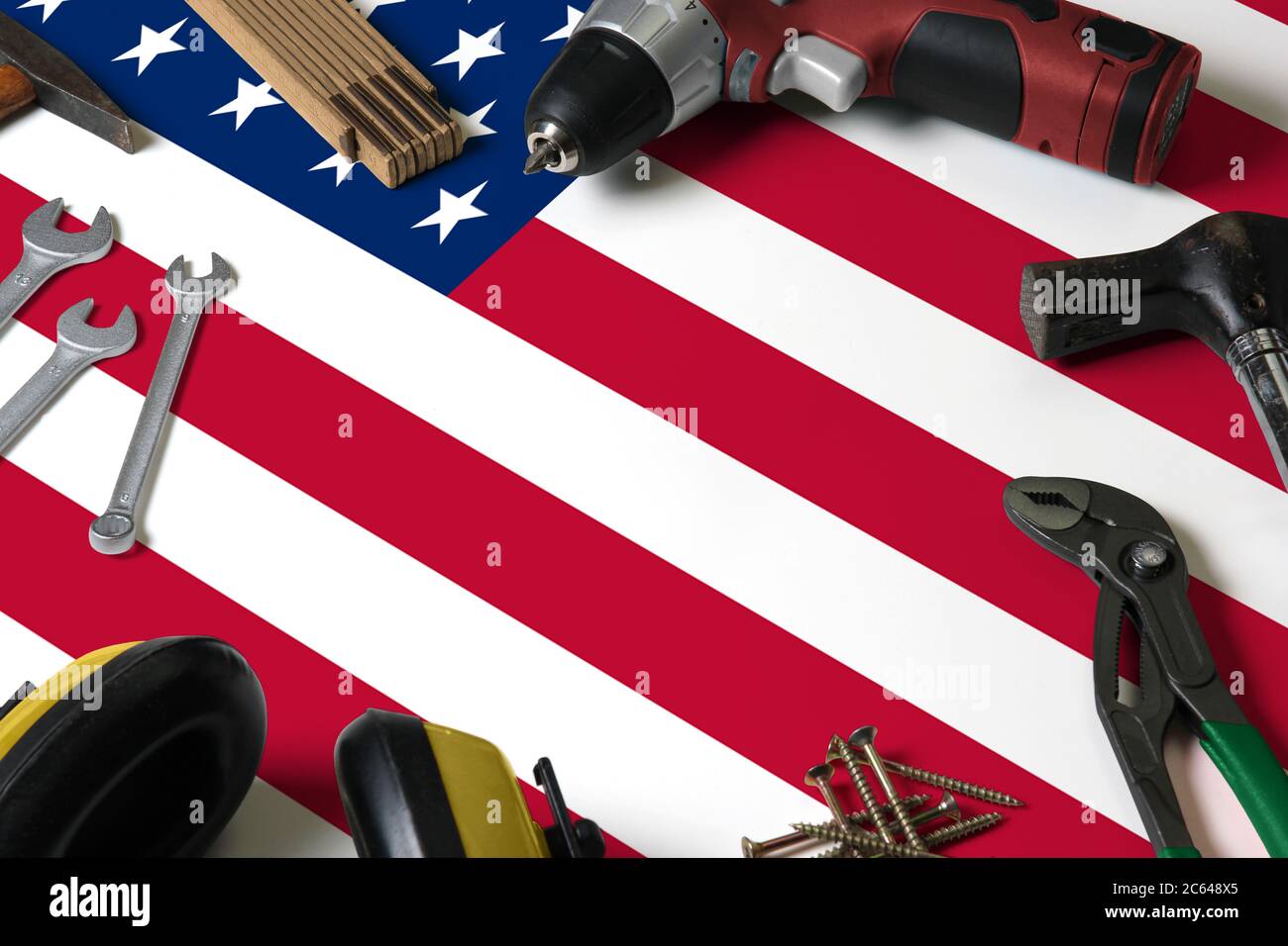 United States flag on repair tool concept wooden table background ...