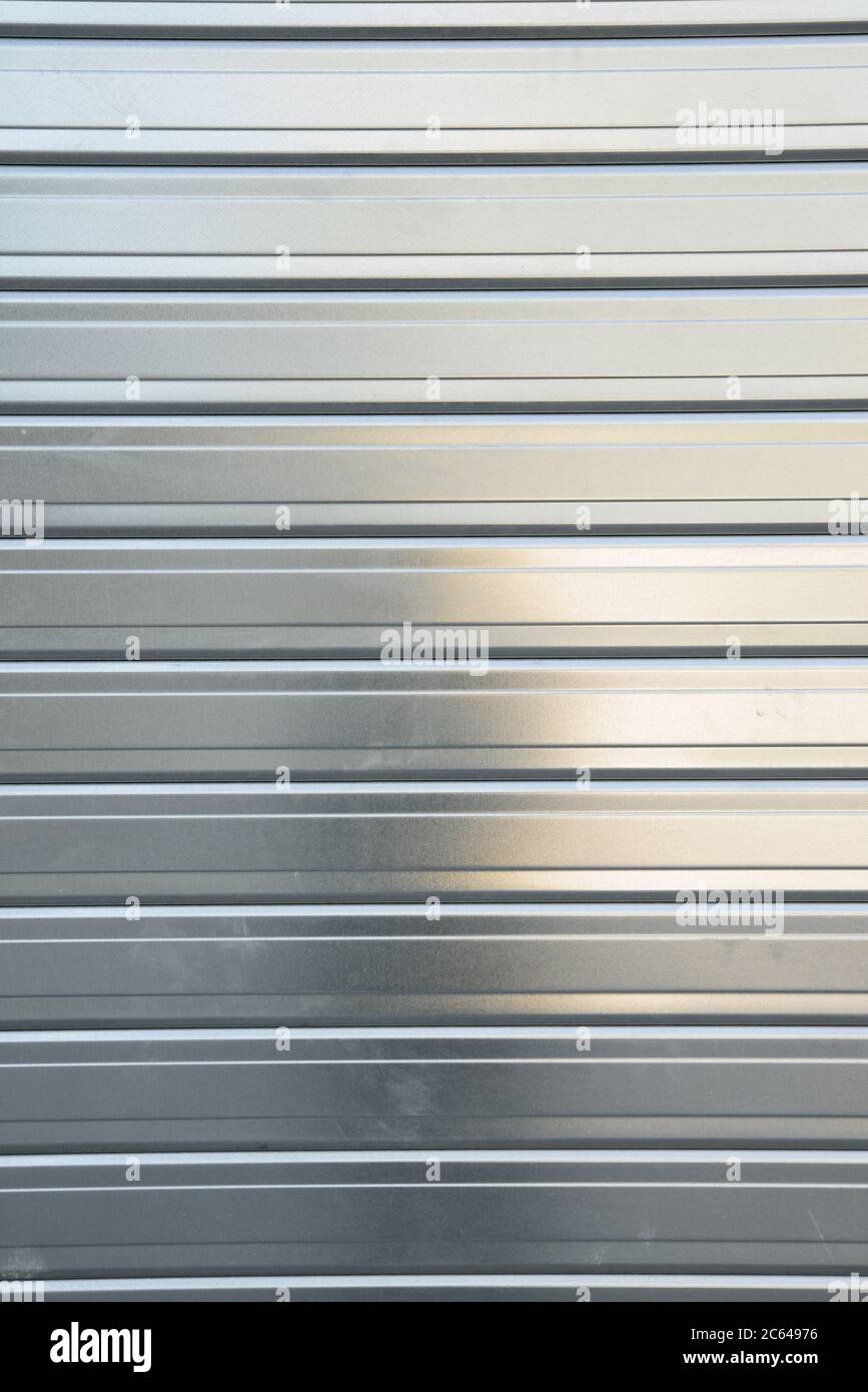 Front view of the metal roller shutter of a store Stock Photo - Alamy