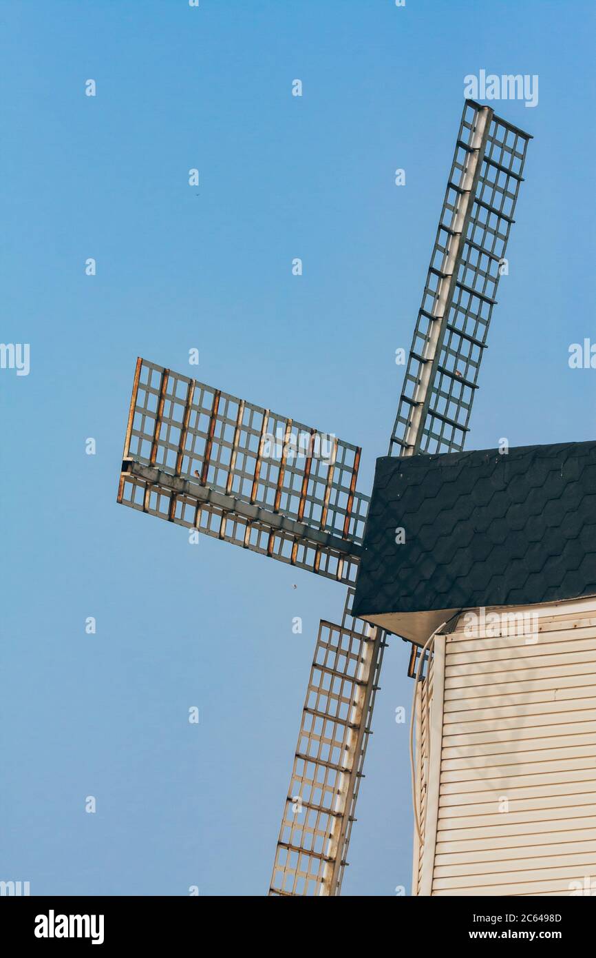 Outdoor turning barn windmill and blue sky Stock Photo - Alamy