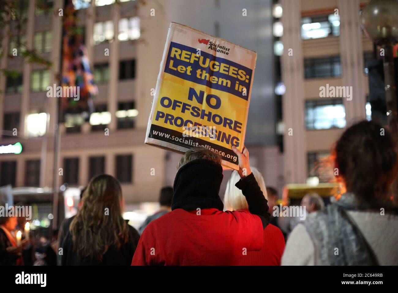 A placard is held at the candle lit vigil for Iranian nation Reza ... A placard is held at the candle lit vigil for Iranian nation Reza ...