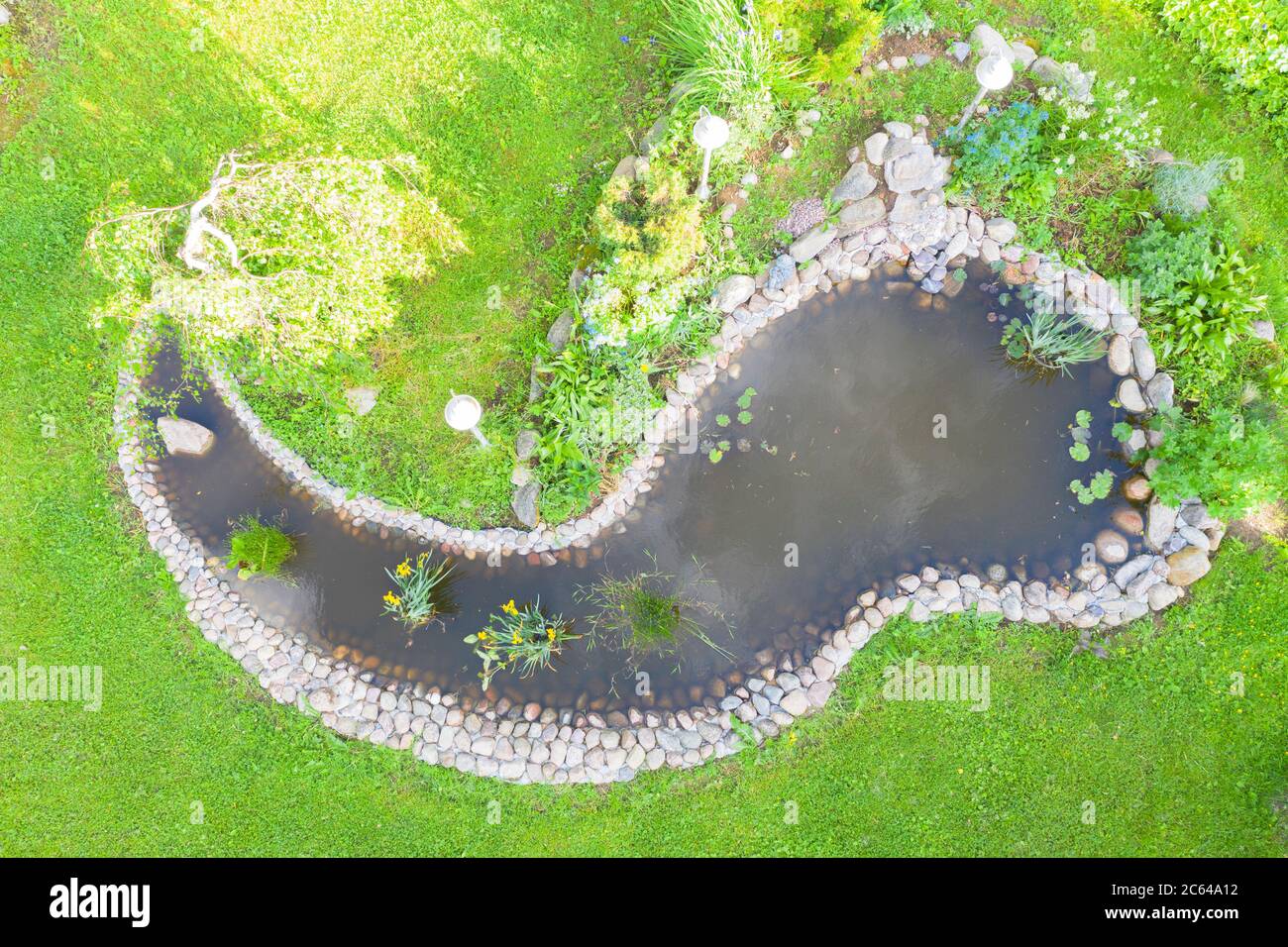 Aerial top view garden pond. Garden fish pond. Garden pond on natural ...