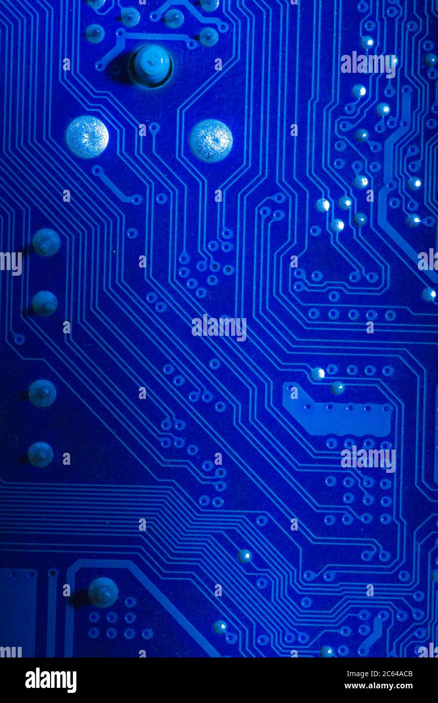Circuit board with blue background Stock Photo - Alamy