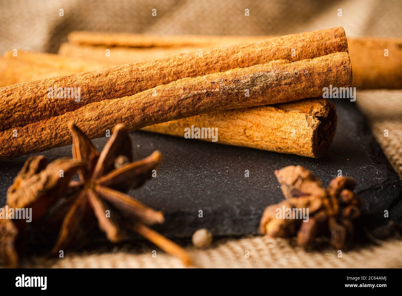 Various spices on a wooden spoon on top of a rag Stock Photo - Alamy