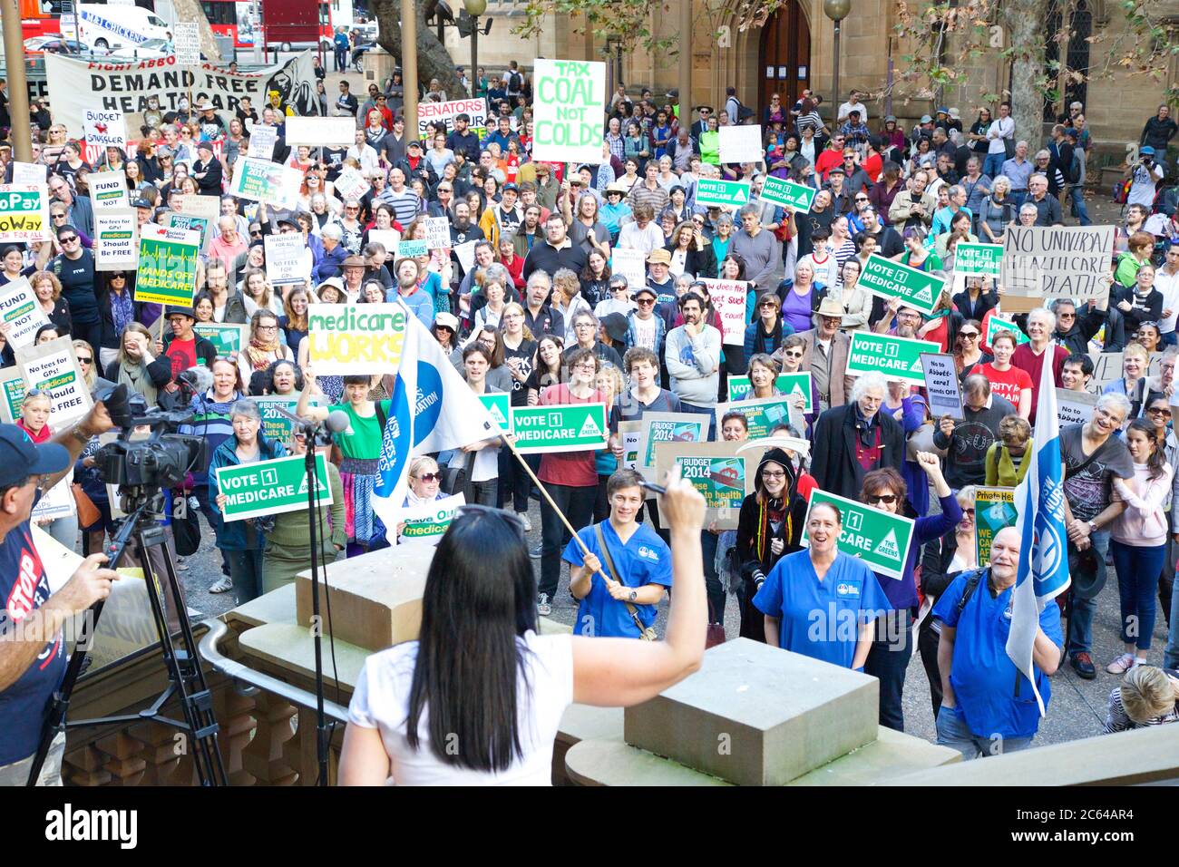 A protest organiser leads some chanting from the steps of Sydney Town ...