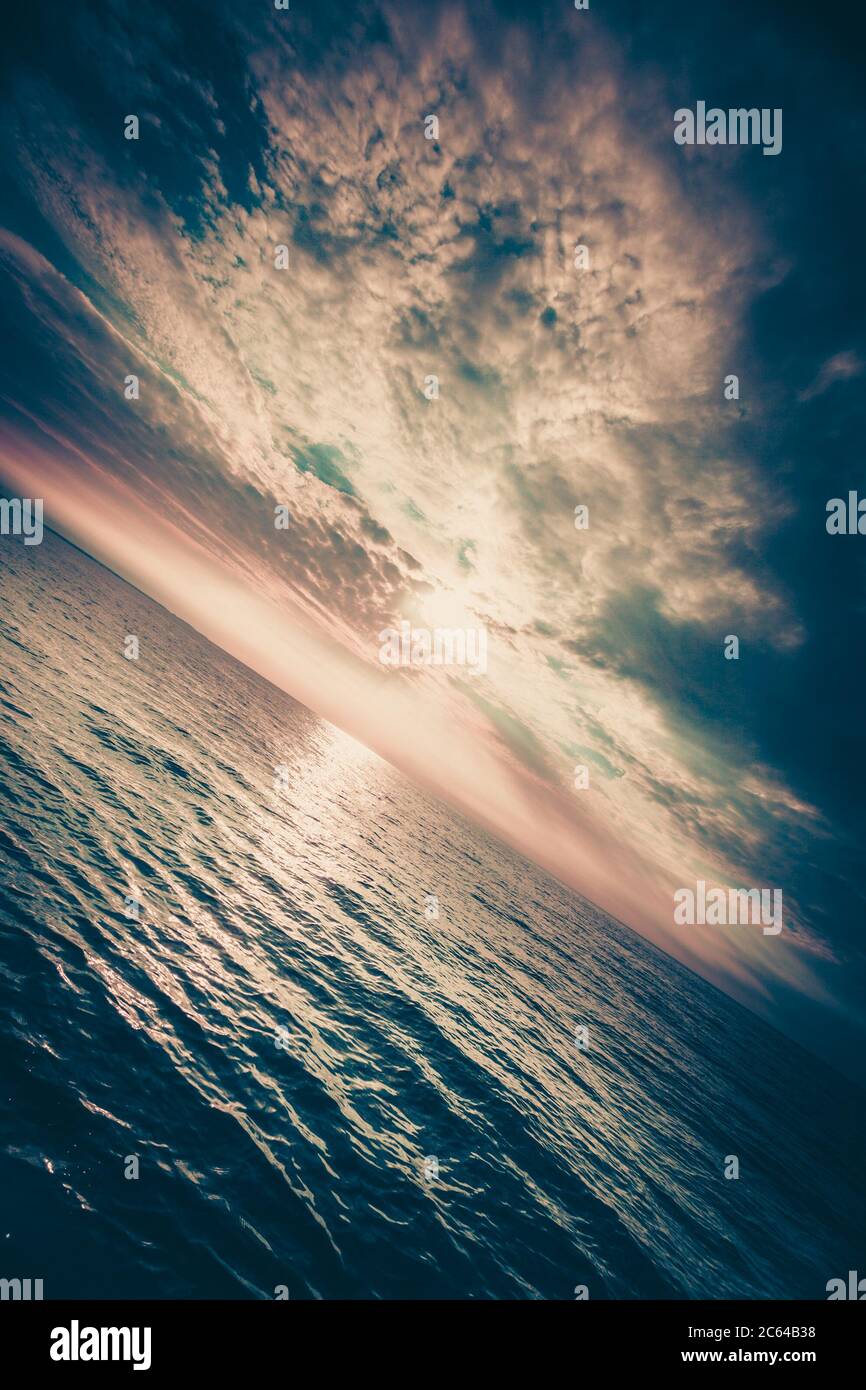 Colorful sunset over evening sea horizon, clouds sky. Tranquil scene ...