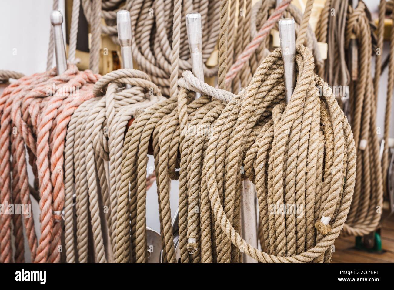 Old fashioned harbor marina sail boat ropes. Yachting details and ...