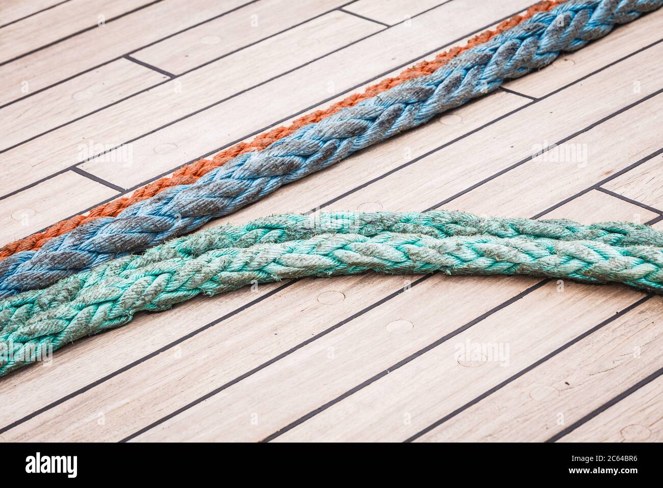 Old fashioned harbor marina sail boat ropes. Yachting details and ...