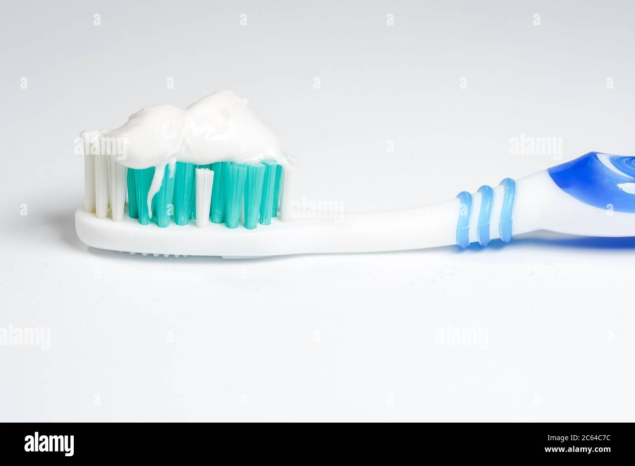 Toothbrush with toothpaste isolated on white background Stock Photo - Alamy