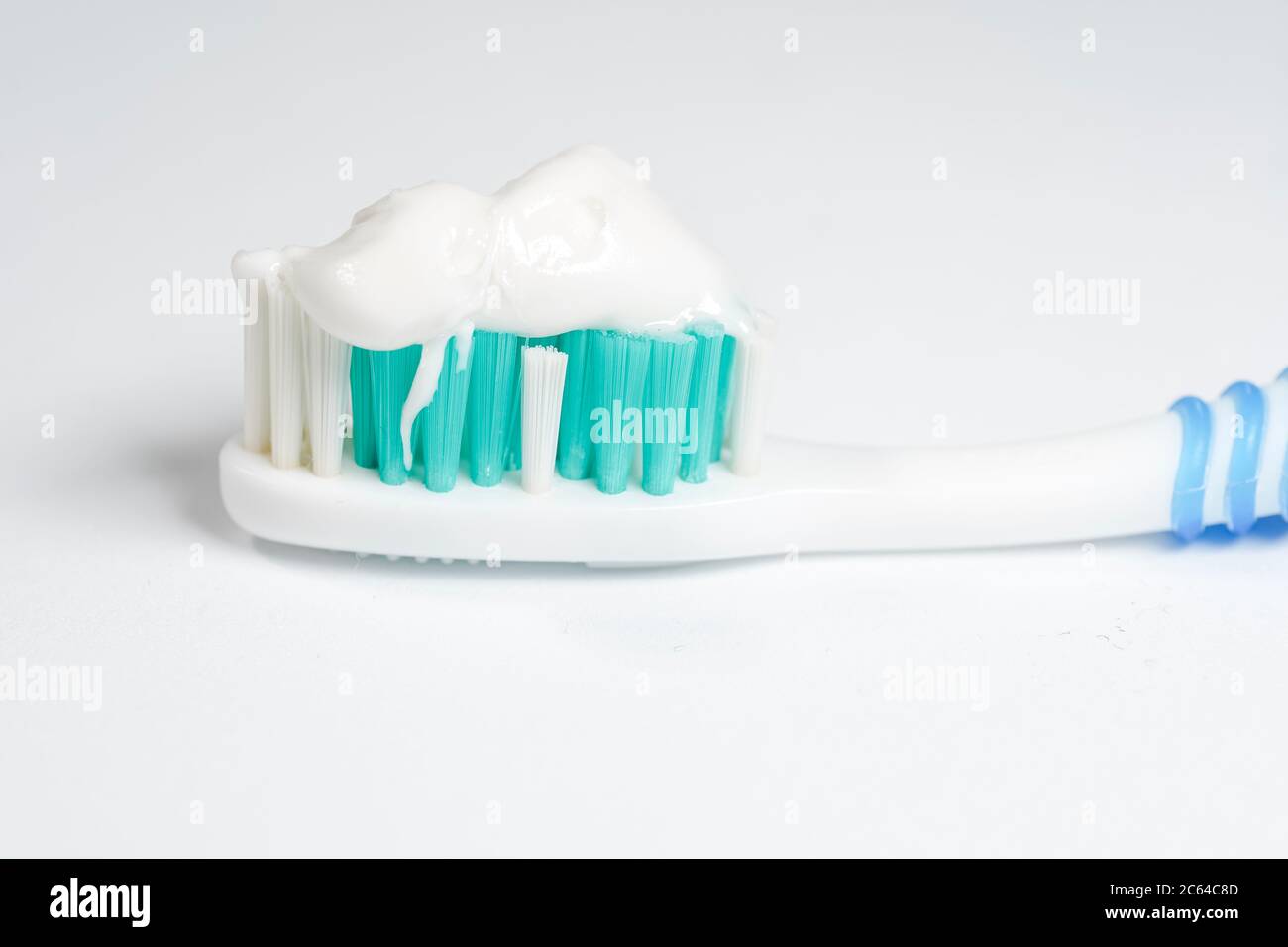 Toothbrush with toothpaste isolated on white background Stock Photo - Alamy