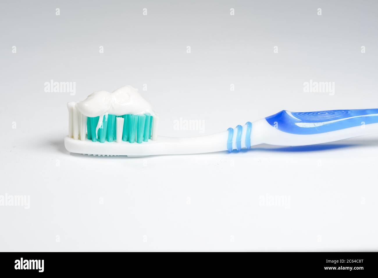 Toothbrush with toothpaste isolated on white background Stock Photo - Alamy
