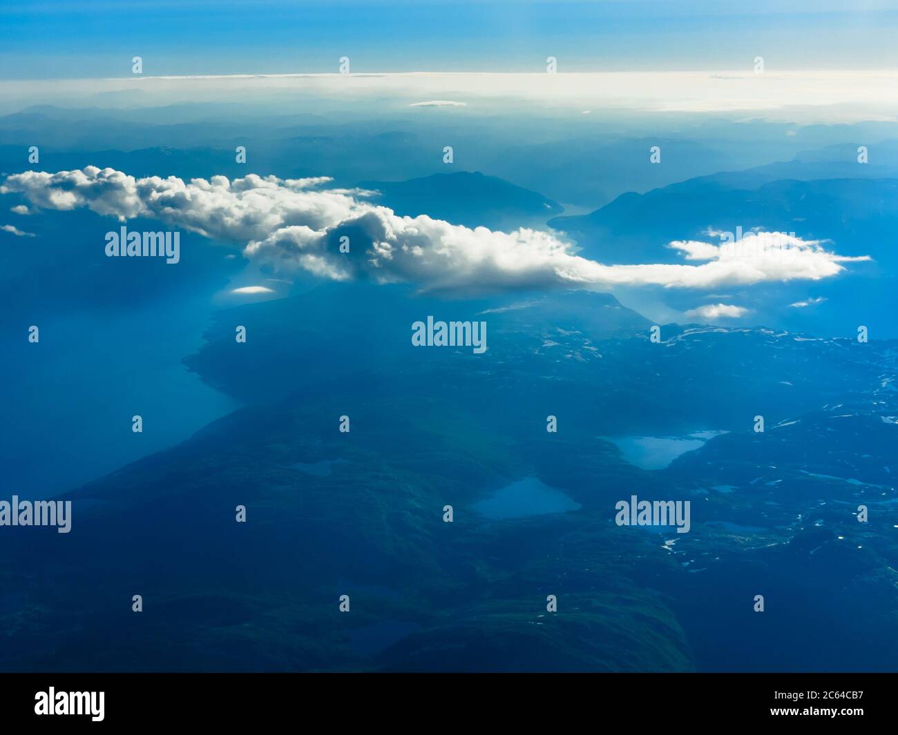 Birds eye. View from window of plane airplane flying over fjords Norway ...