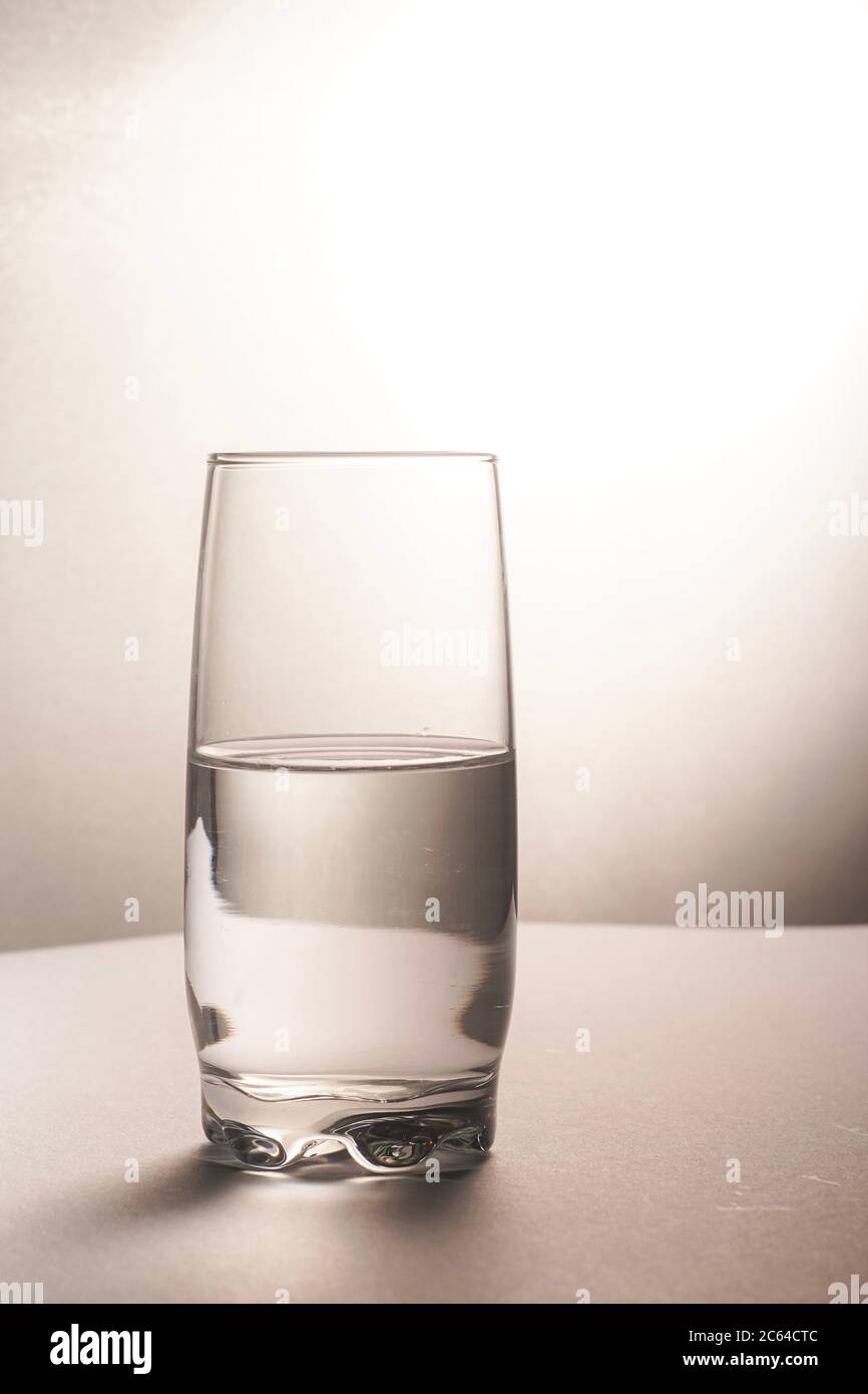 Glass half empty or glass half full. Psychology or motivational concept ...