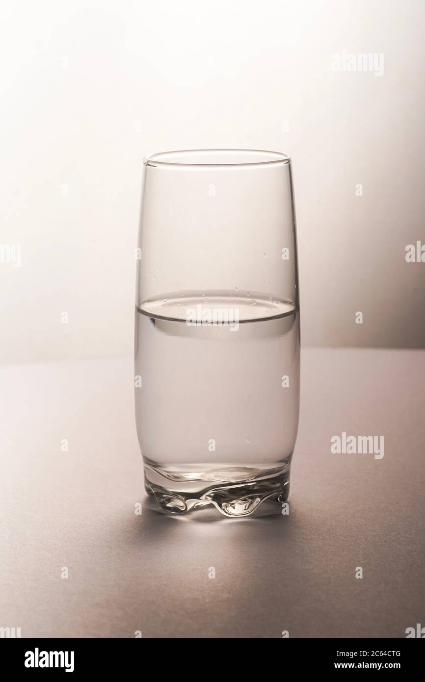 Glass half empty or glass half full. Psychology or motivational concept ...