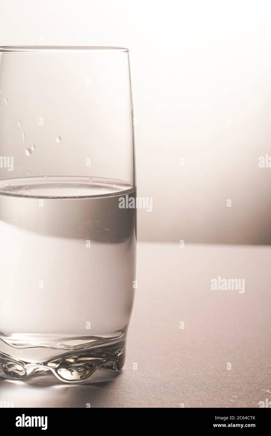 Glass half empty or glass half full. Psychology or motivational concept ...