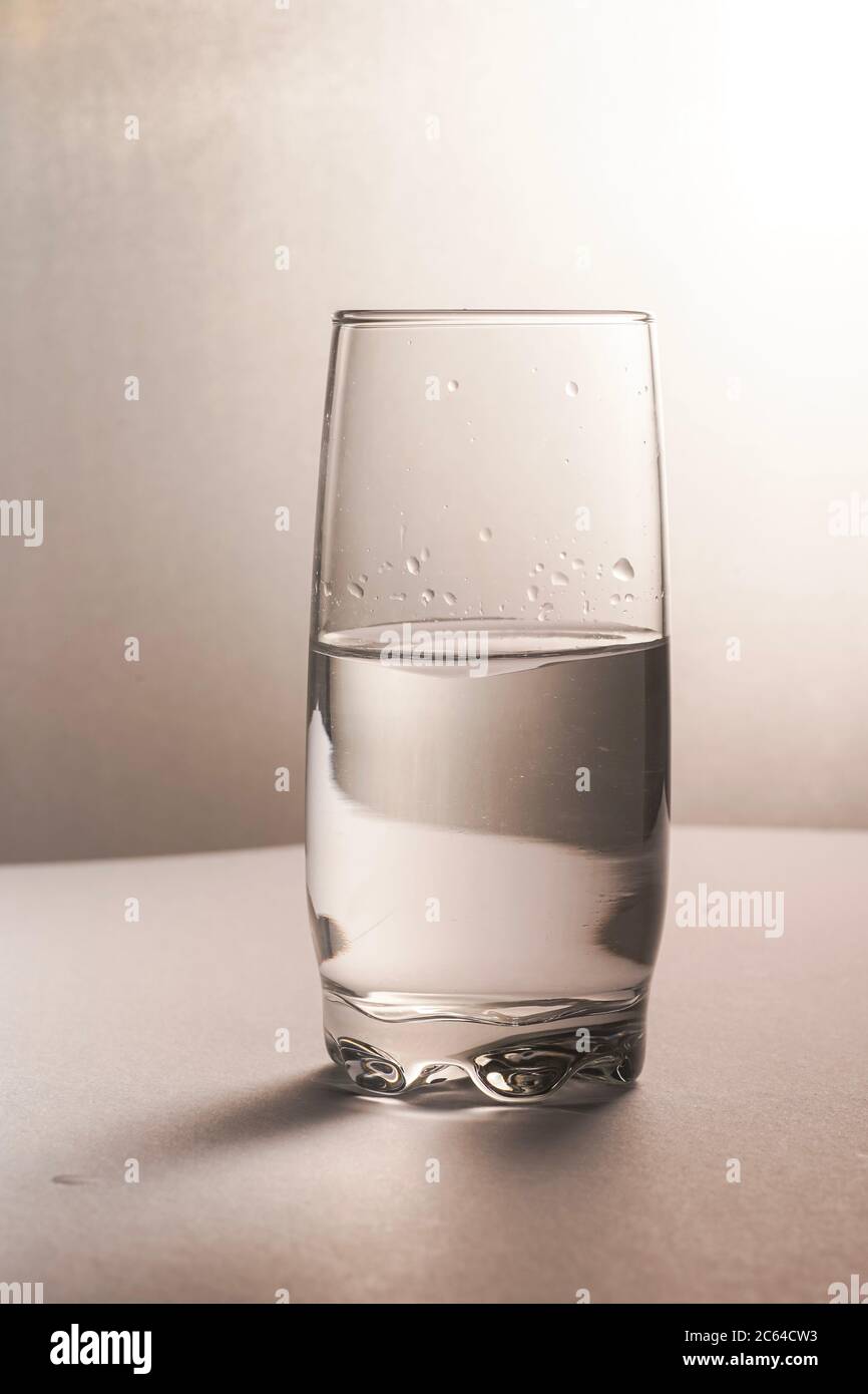 Glass half empty or glass half full. Psychology or motivational concept ...
