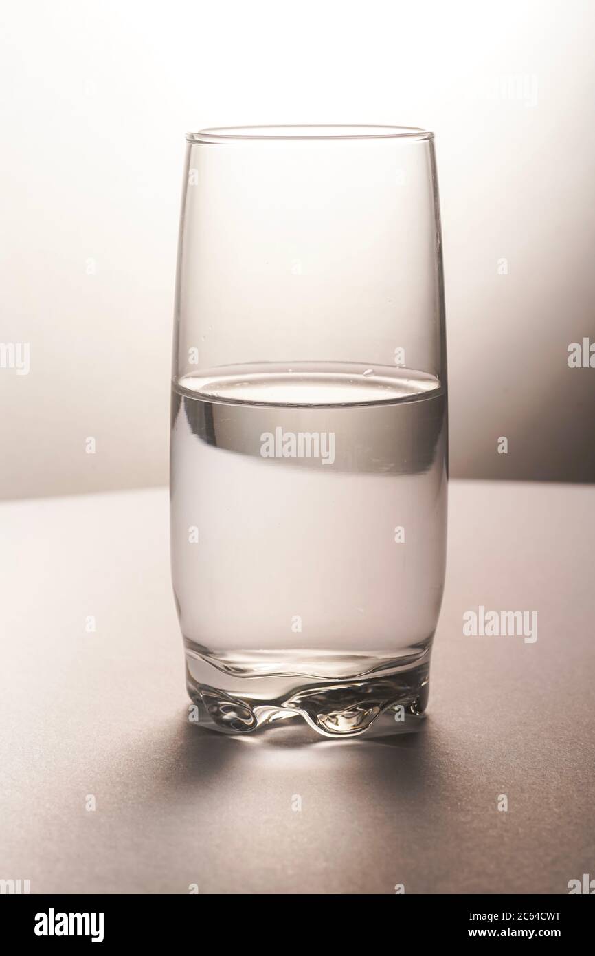 Glass half empty or glass half full. Psychology or motivational concept ...