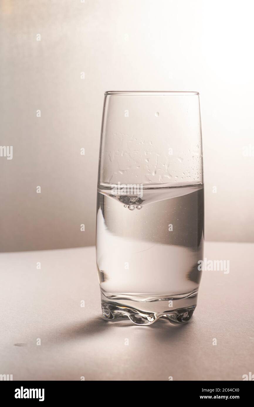 Glass half empty or glass half full. Psychology or motivational concept ...