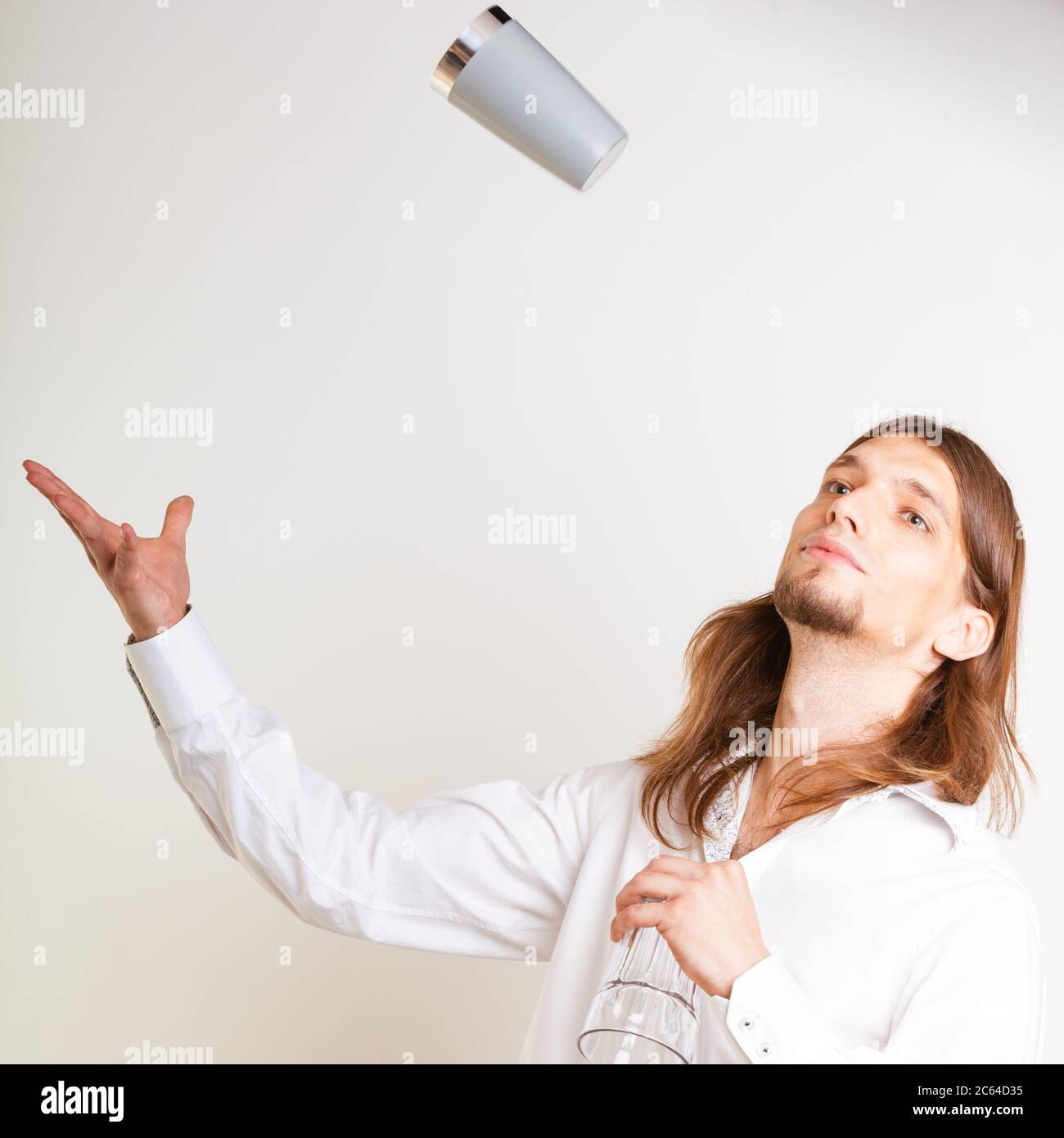 Show party alcohol liquor concept. Skilled bartender juggling with ...