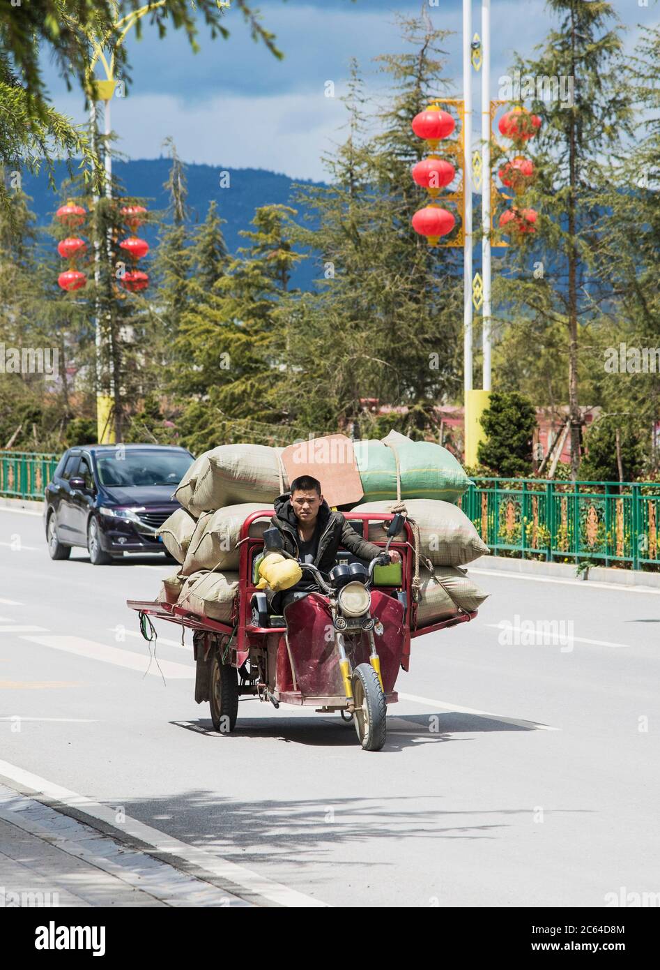 Driving an old vehicle on the road in the Yunnan Province of South West ...