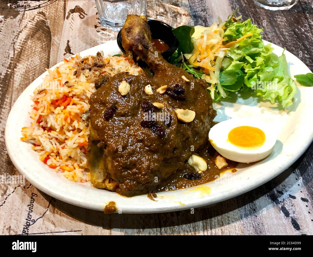 A plate of chicken Biryani on a table Stock Photo - Alamy