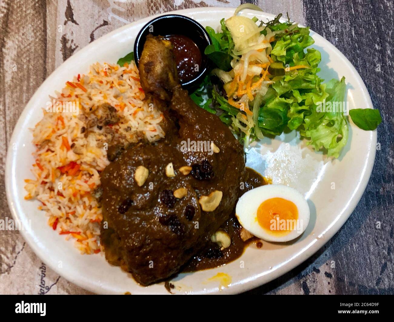 A plate of chicken Biryani on a table Stock Photo - Alamy