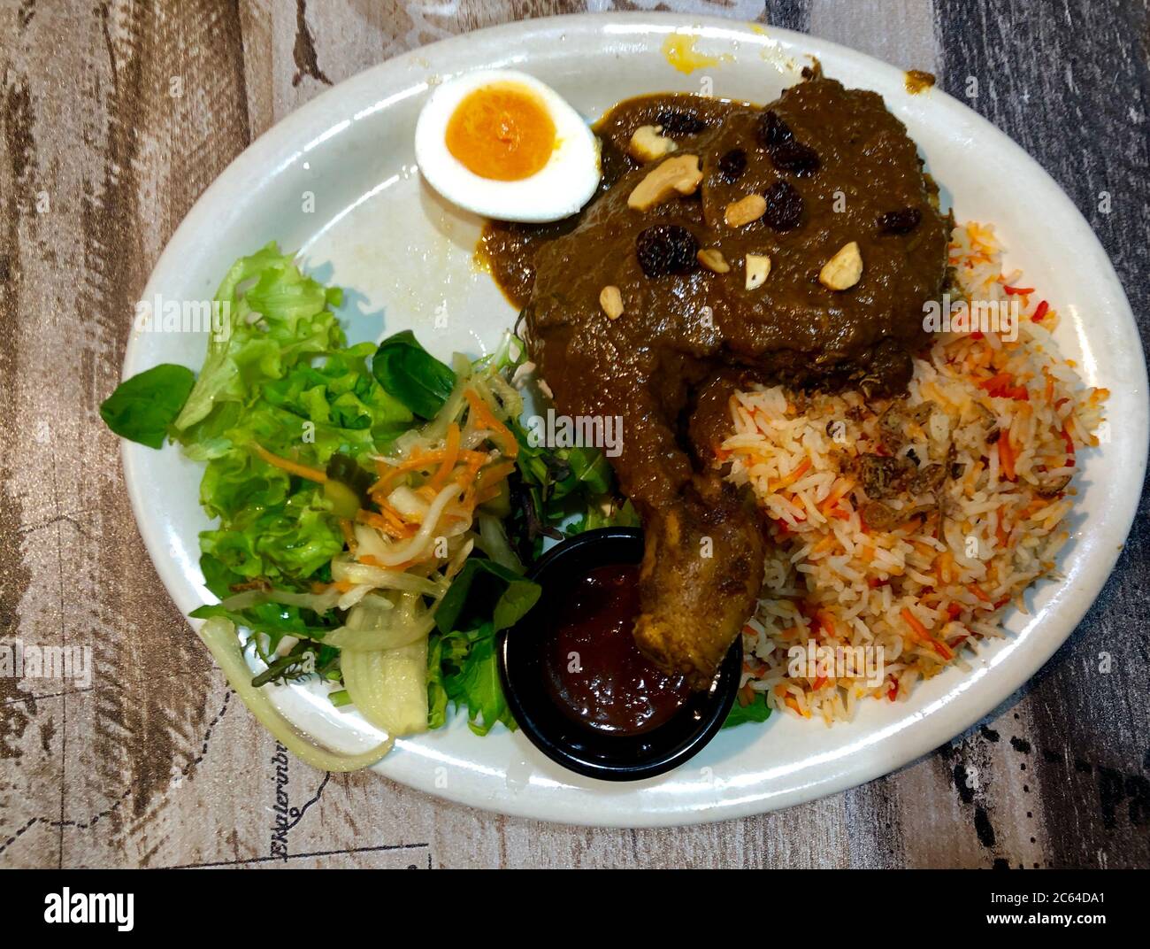 A plate of chicken Biryani on a table Stock Photo - Alamy